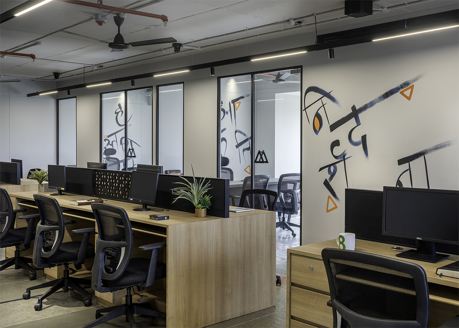 Pune’s dynamic metal office is decked up in down-to-earth materials ...