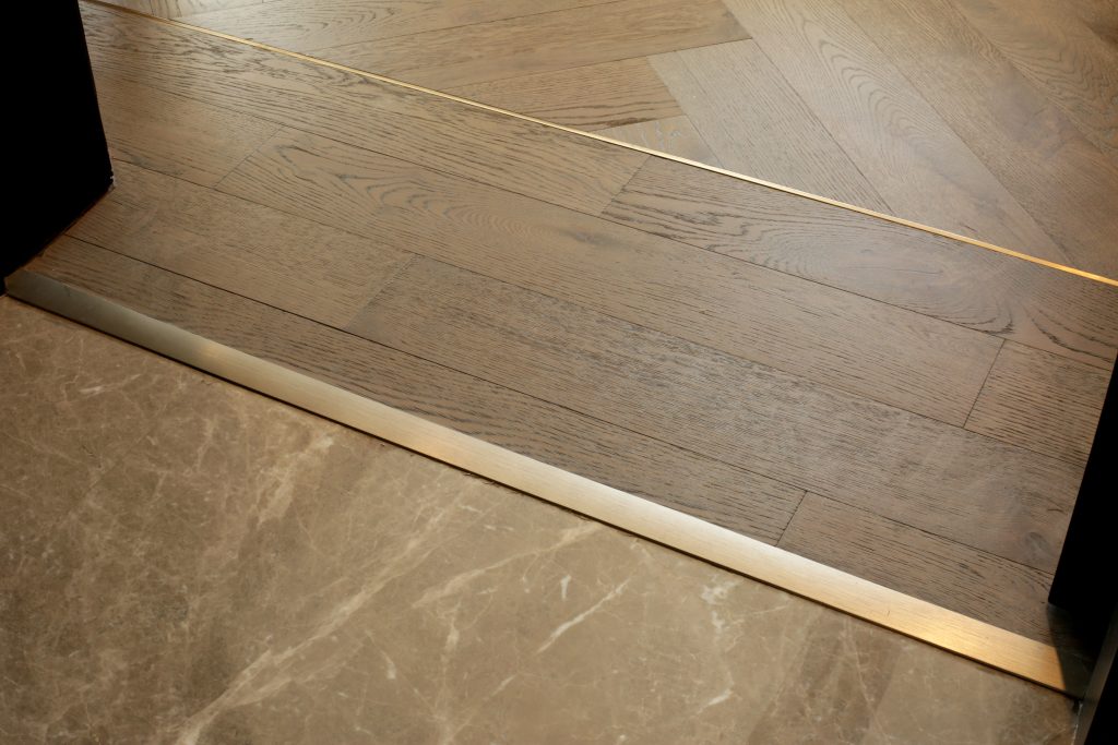 Bridge flooring transitions with these elegant profile systems ...
