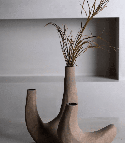Witness the raw yet refined elegance of this artistic vase collection ...