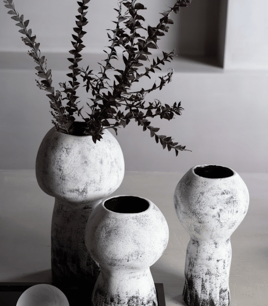Witness the raw yet refined elegance of this artistic vase collection ...