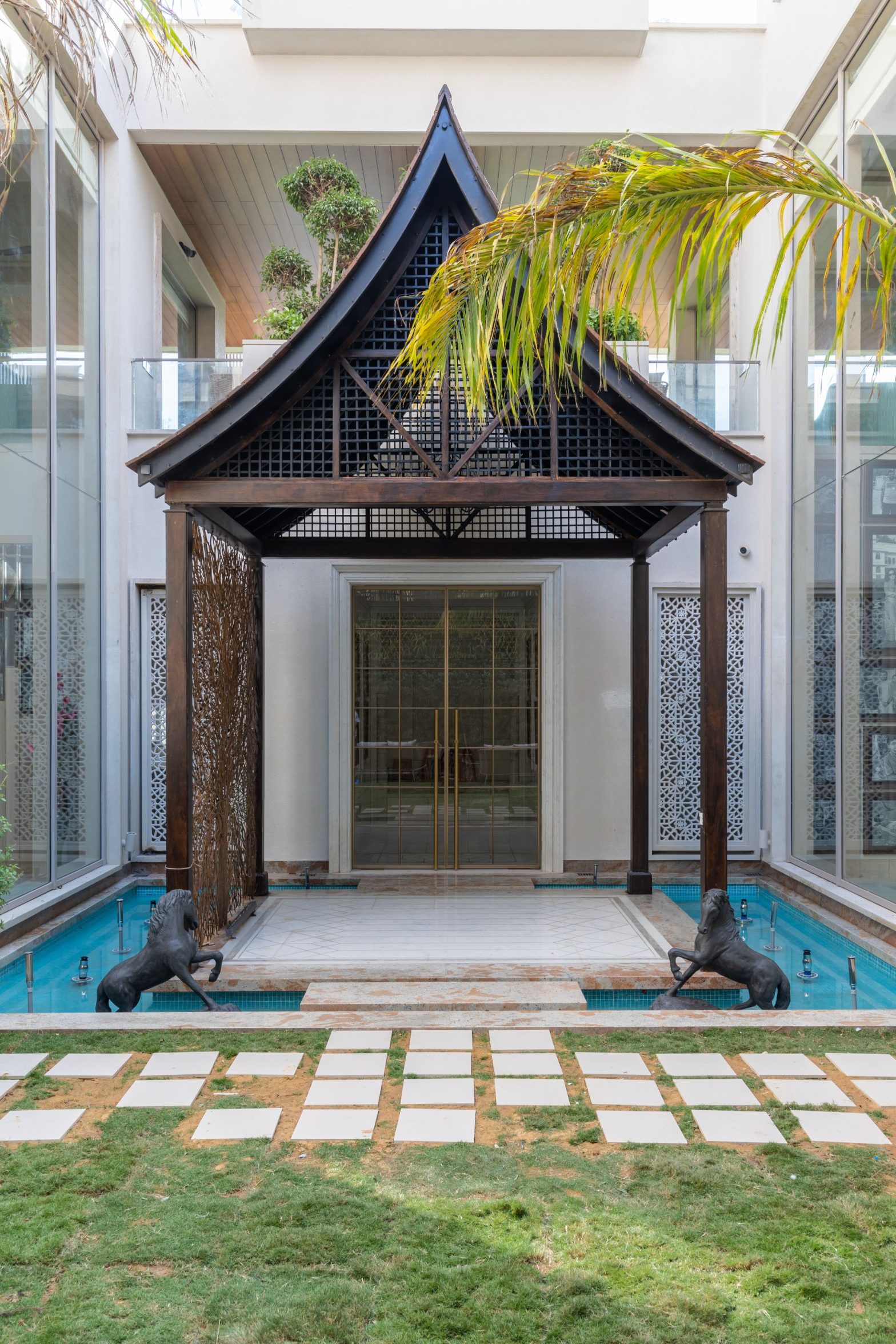 Fortify familial values within the entwining design of this twin house ...